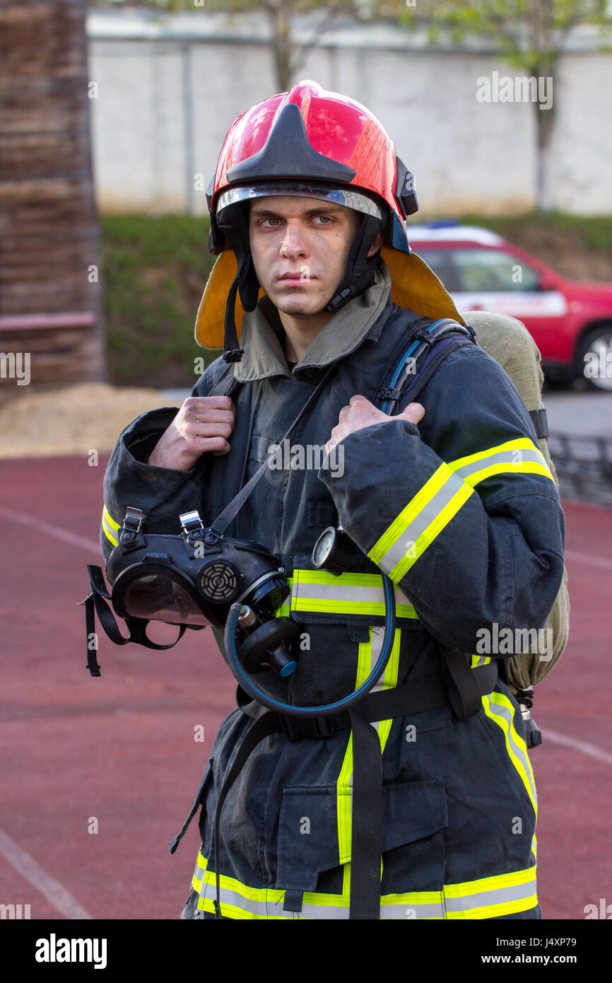 Portrait of heroic fireman with an axe outdoors Stock Photo - Alamy
