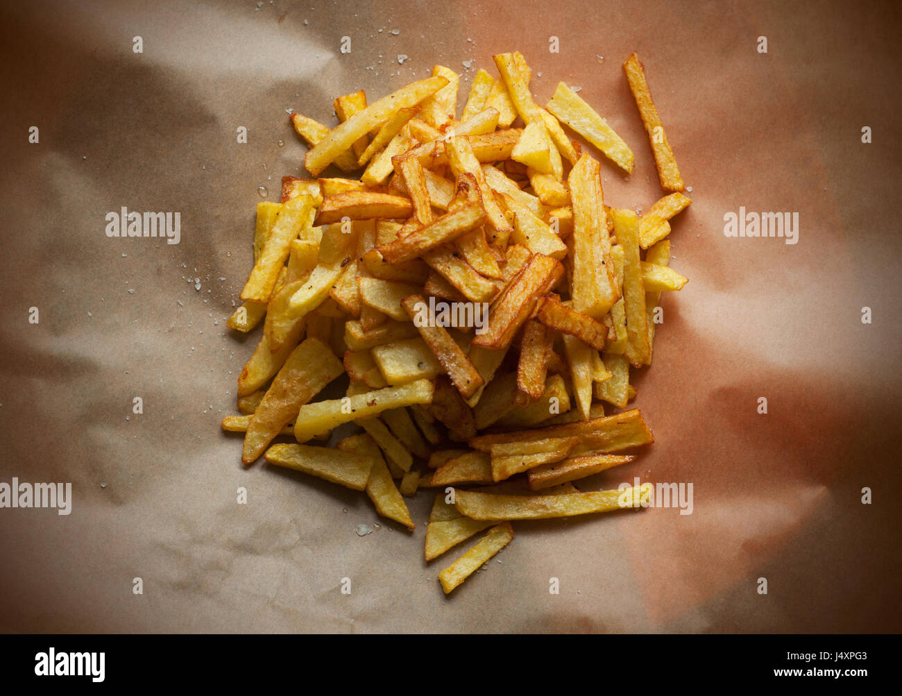 Homemade fried potatoes on brown paper Stock Photo - Alamy