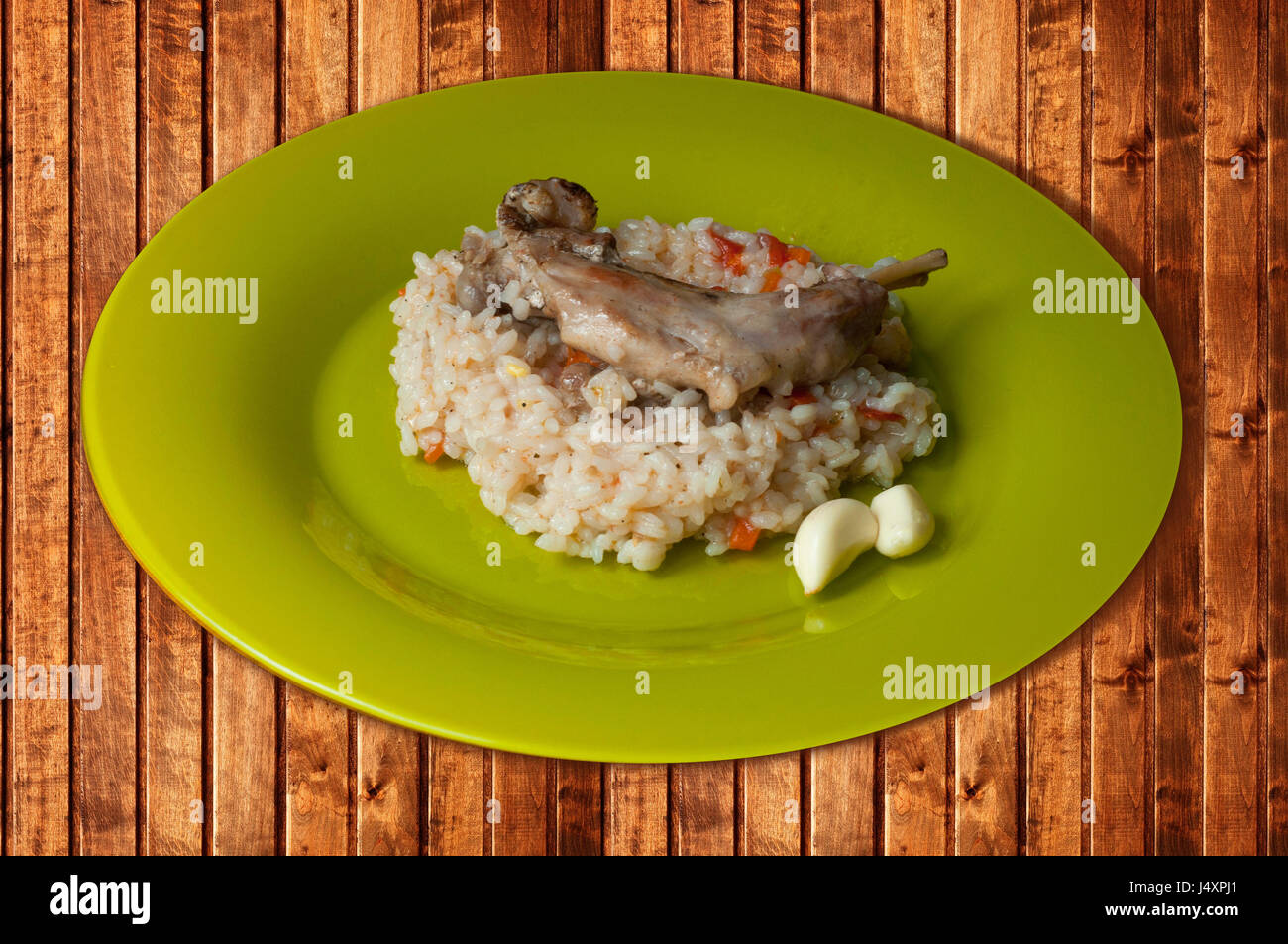 Rice pilaf with rabbit meat and vegetables. Traditional middle eastern ...