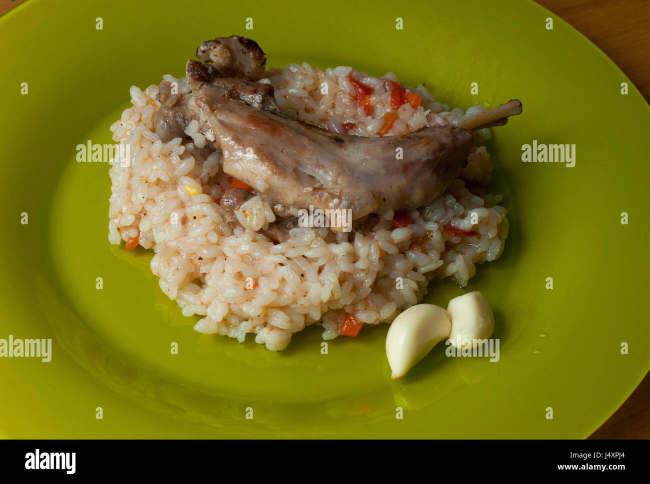 Rice pilaf with rabbit meat and vegetables. Traditional middle eastern ...