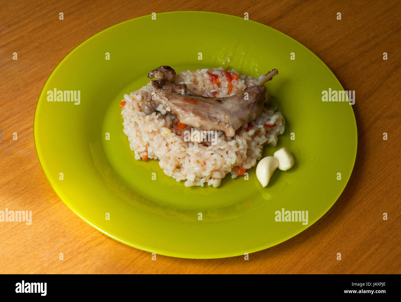 Rice pilaf with rabbit meat and vegetables. Traditional middle eastern ...