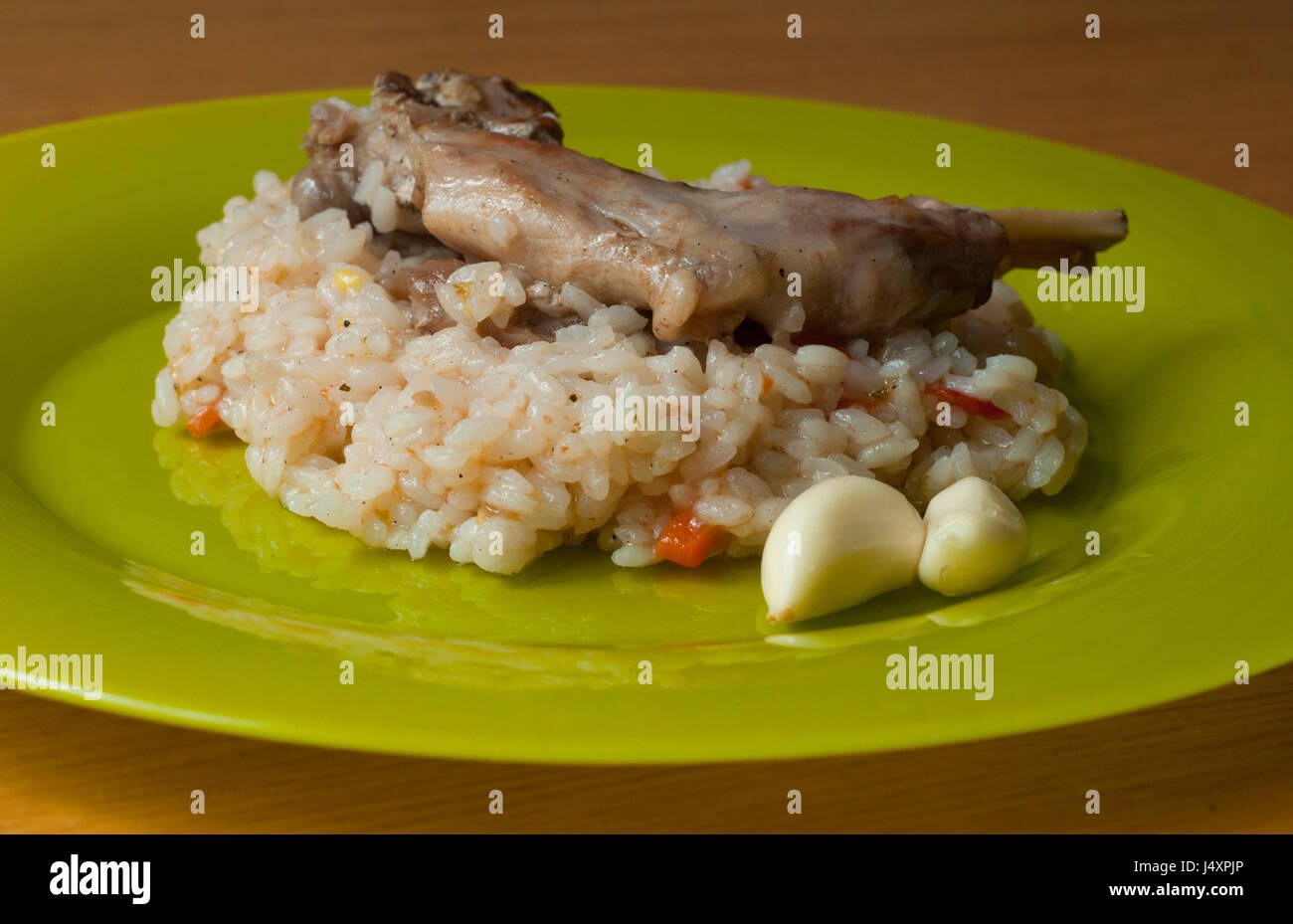 Rice pilaf with rabbit meat and vegetables. Traditional middle eastern ...