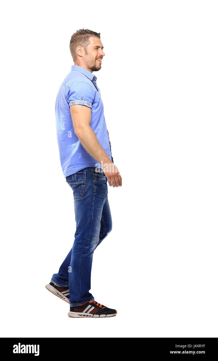 side view of a smiling casual man walking , on white background Stock ...