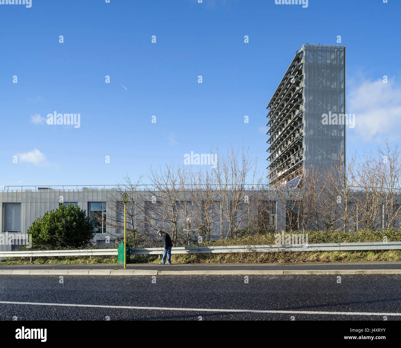 View across street towards building complex with service tower. Gas ...