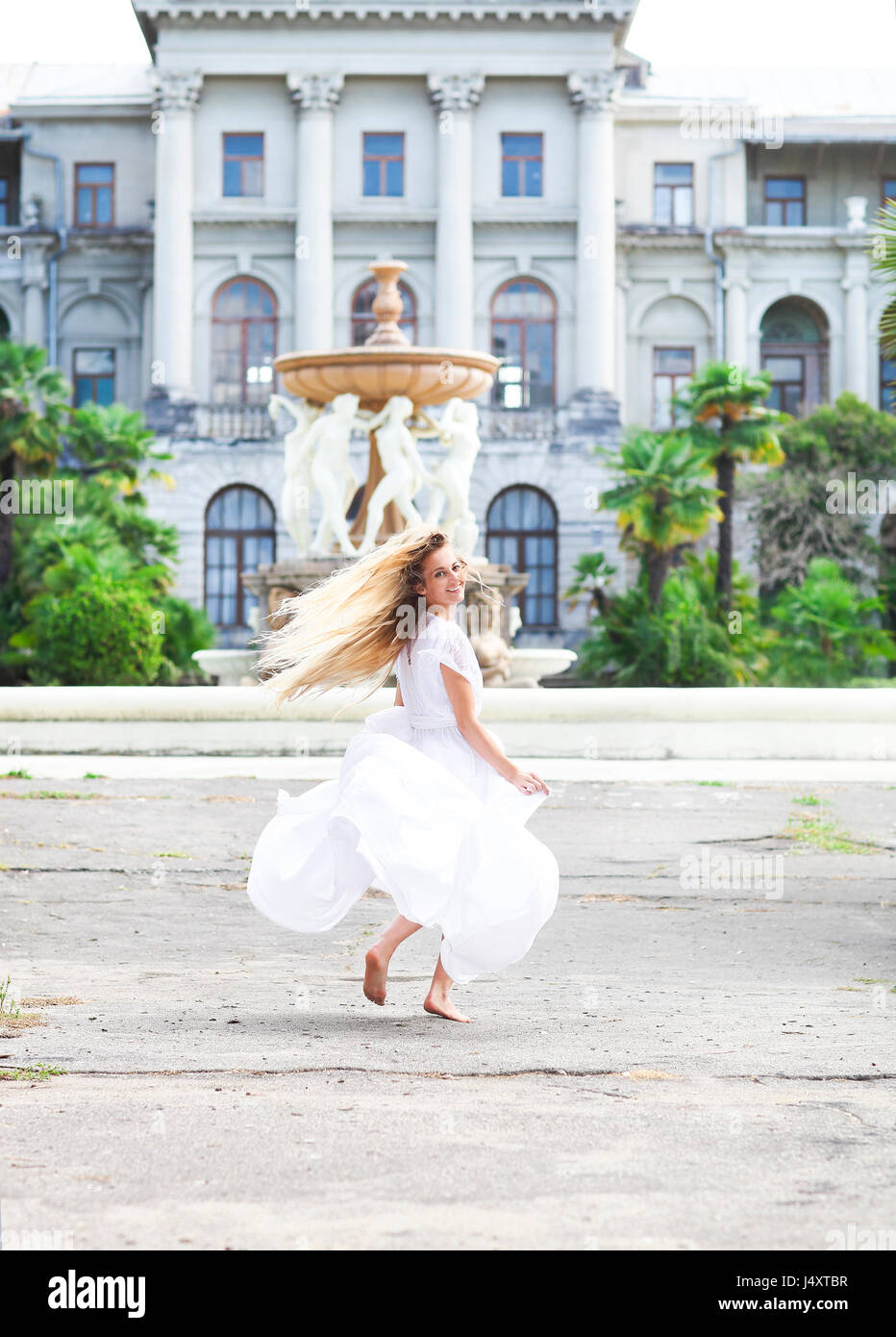 Beautiful happy running bride outdoors in park Stock Photo - Alamy