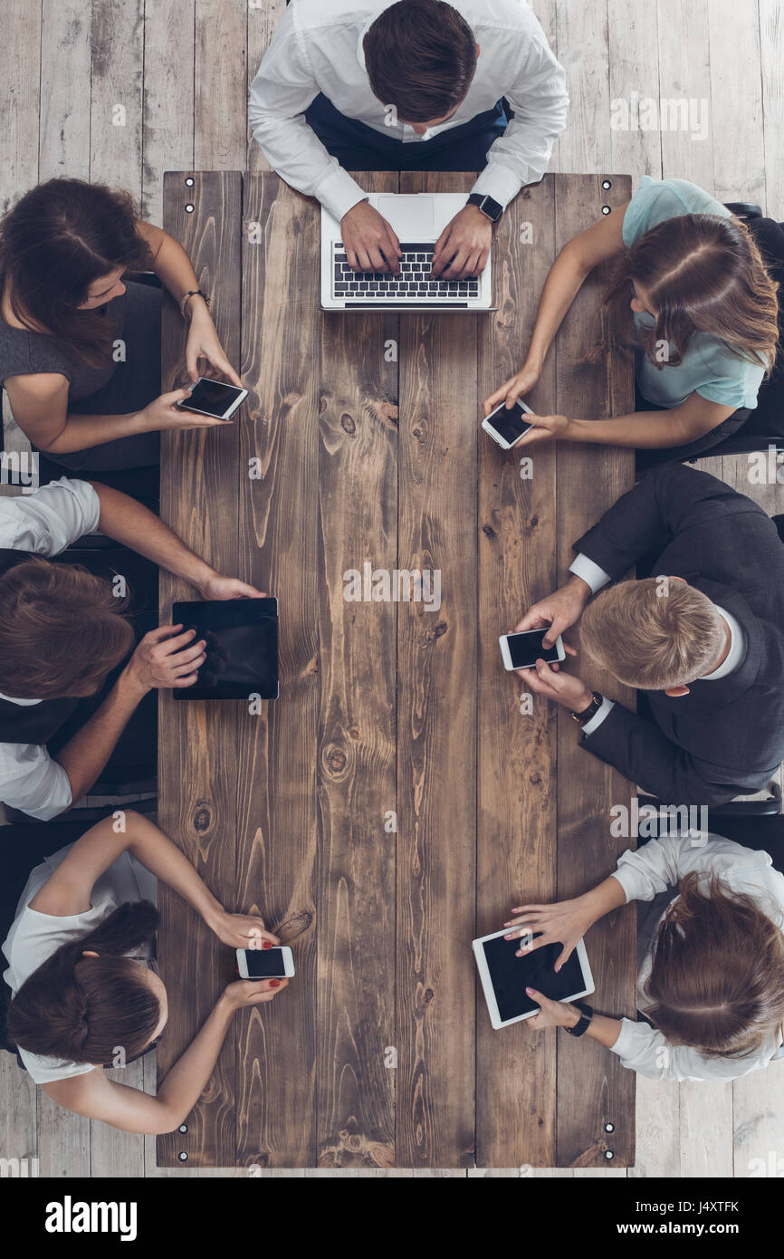 Business people man and women meeting in the office top view using ...