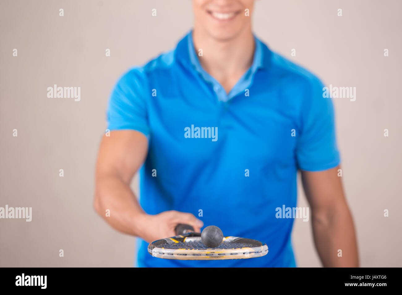 Young man squash player exercise game in the gym Stock Photo - Alamy