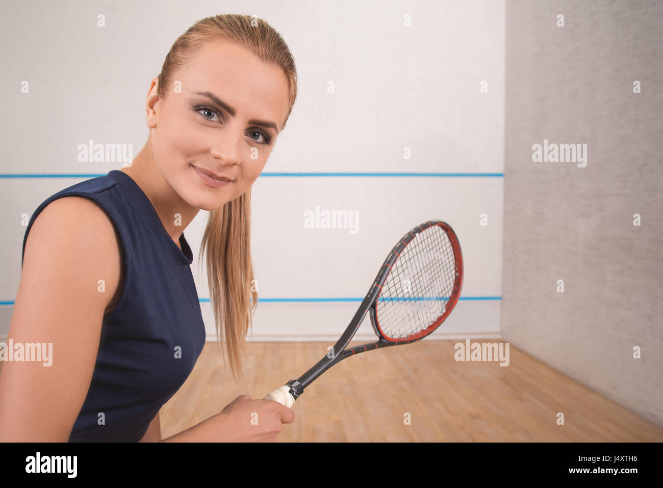 Young woman squash player exercise game in the gym Stock Photo - Alamy