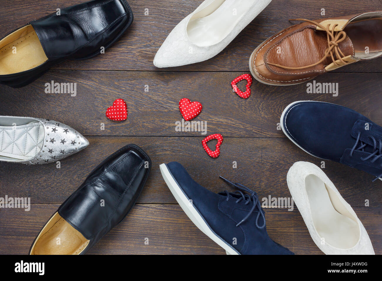 Top view red heart shape with fashionnable several men's shoes and ...
