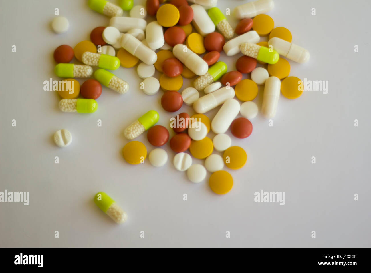 Pills of different colors from above Stock Photo - Alamy