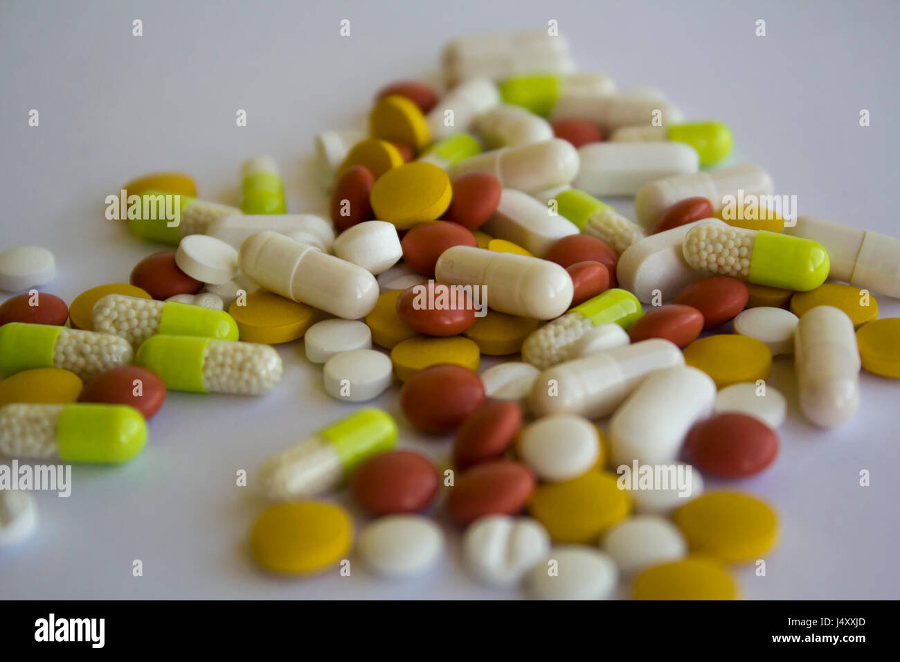 Assorted Pills on a white background Stock Photo - Alamy