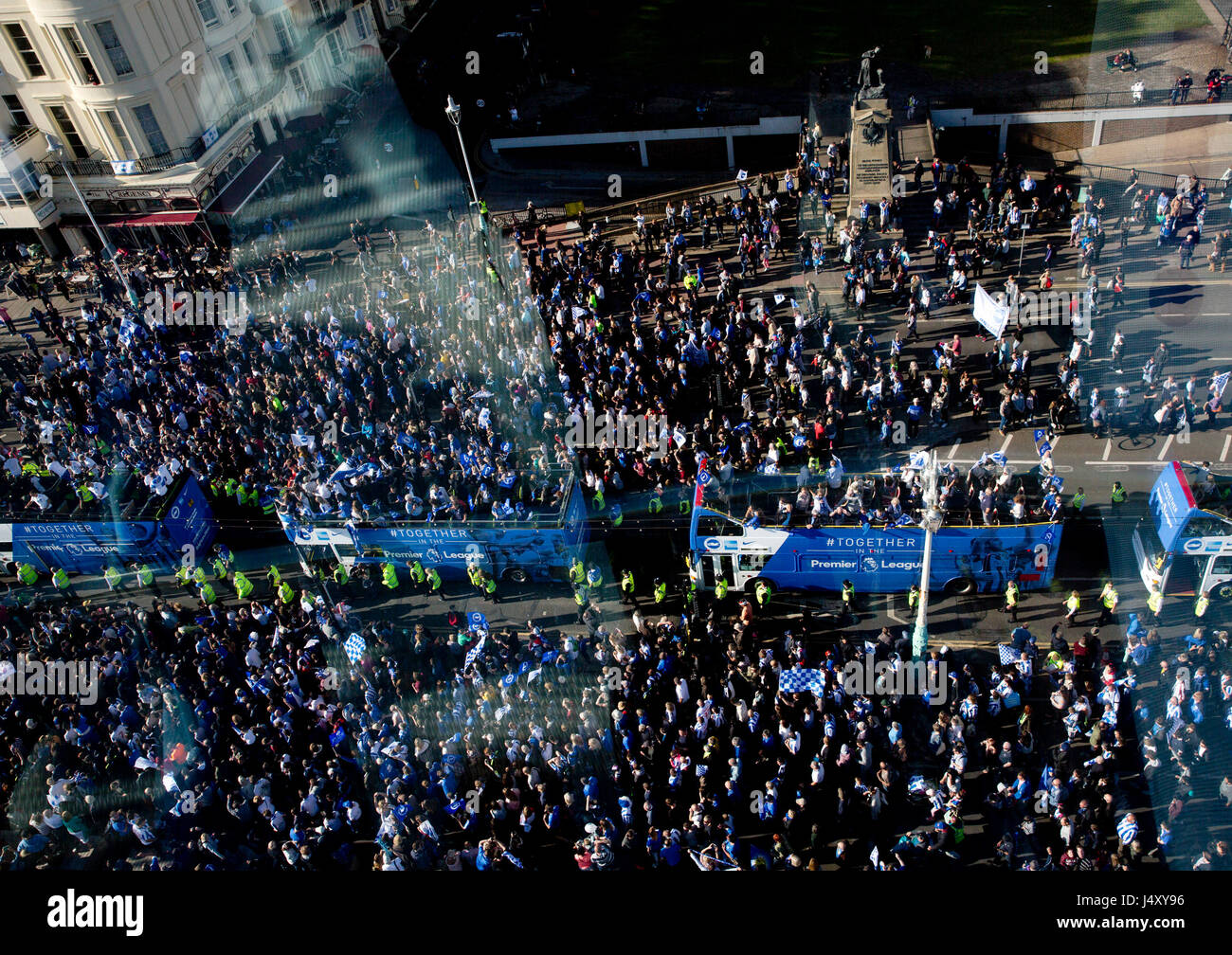 Brighton and Hove Albion football fans cheer their team during the bus ...