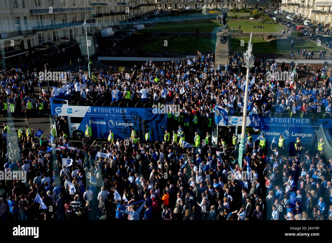 Brighton and Hove Albion football fans cheer their team during the bus ...