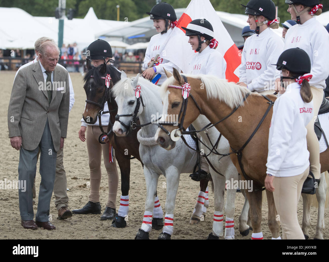 The Duke of Edinburgh presents the trophy and rosettes to team England ...