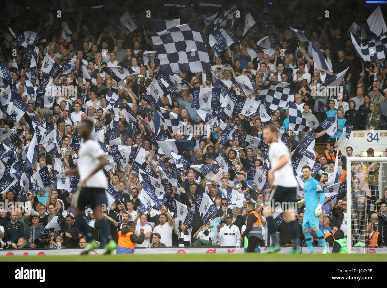 Tottenham fans wave flags during the Premier League match at White Hart ...