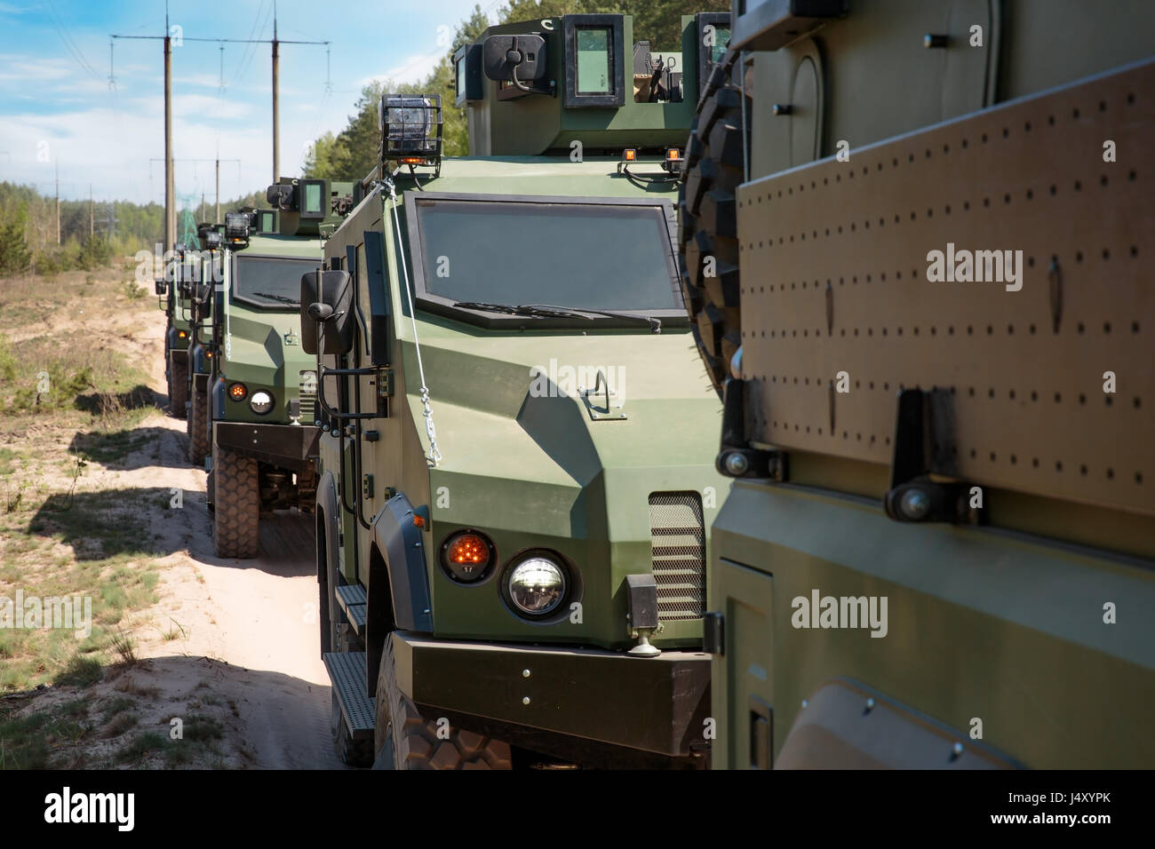 A column of Russian armored vehicles at the demonstration on polygon ...