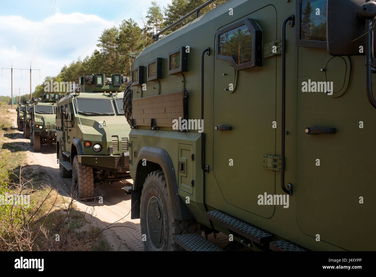 A column of Russian armored vehicles at the demonstration on polygon ...