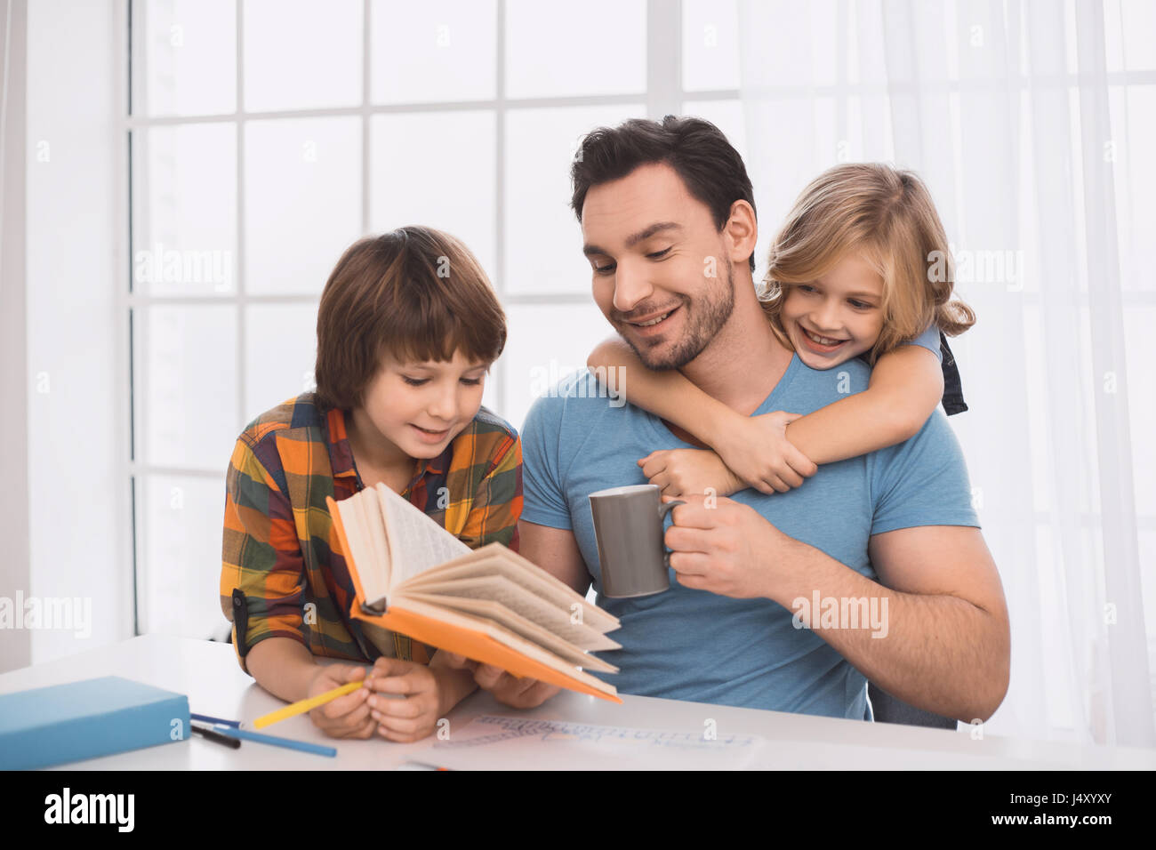Young man father family time with kids Stock Photo - Alamy