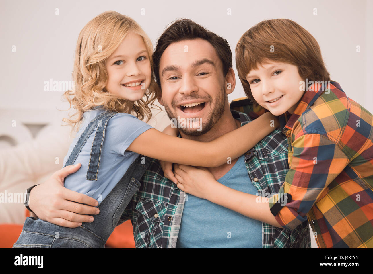 Young man father family time with kids Stock Photo - Alamy