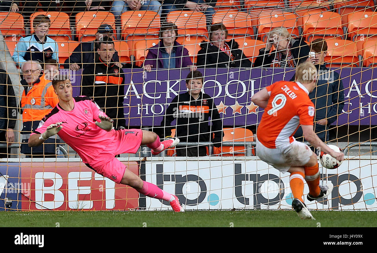 Blackpool's Mark Cullen scores his teams third goal past Luton Town's Stuart Moore from the ...