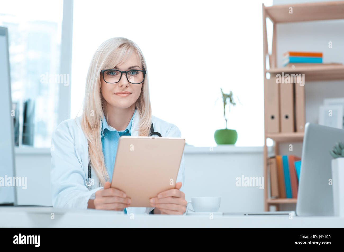 Young woman doctor occupation in the hospital office Stock Photo - Alamy