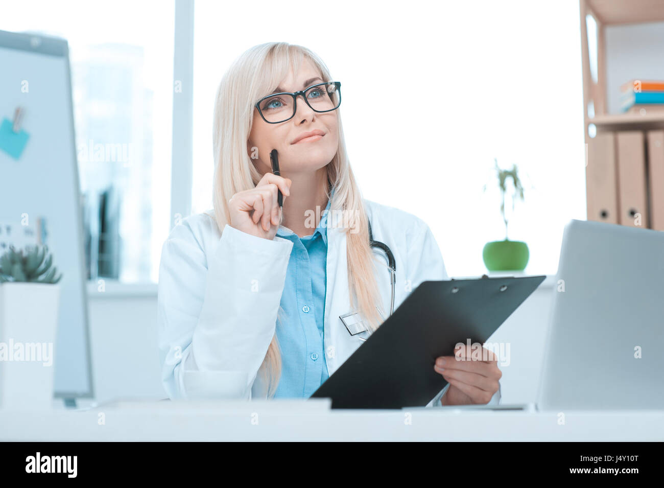 Young woman doctor occupation in the hospital office Stock Photo - Alamy