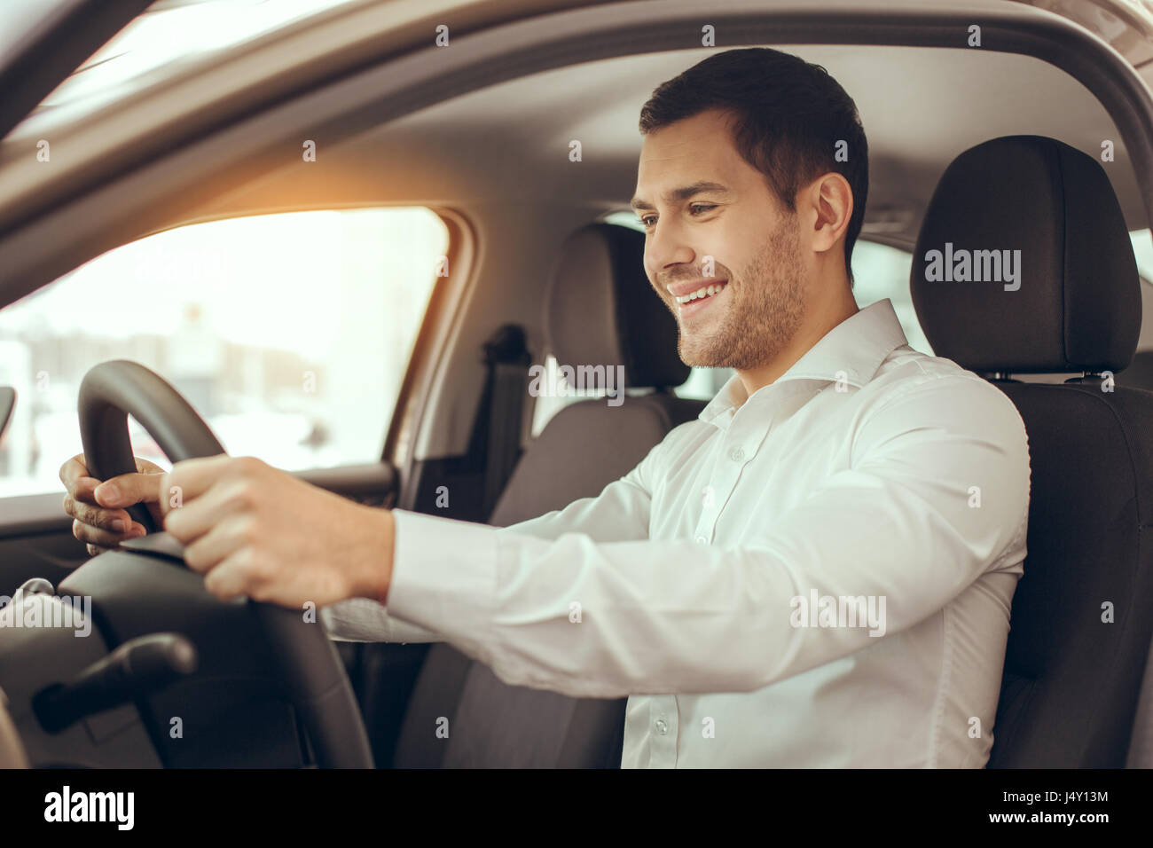 Young Man in a Car Rental Service Test Drive Concept Stock Photo - Alamy