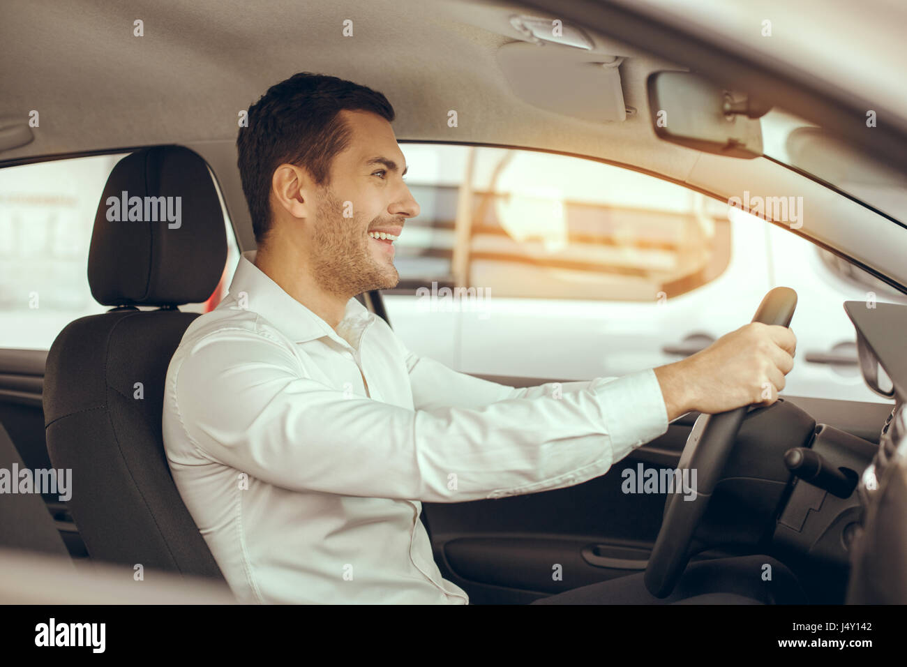 Young Man in a Car Rental Service Test Drive Concept Stock Photo - Alamy
