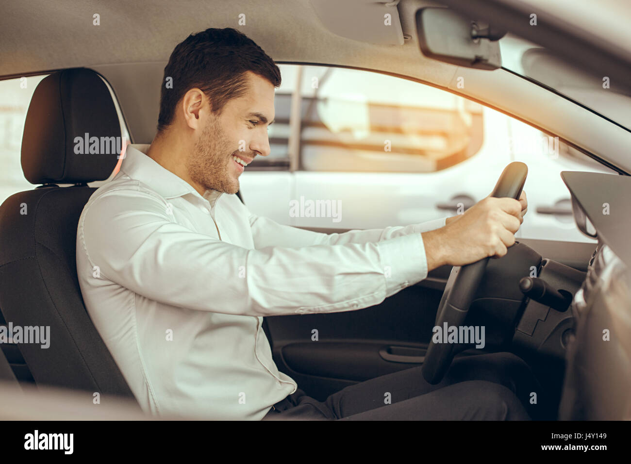 Young Man in a Car Rental Service Test Drive Concept Stock Photo - Alamy