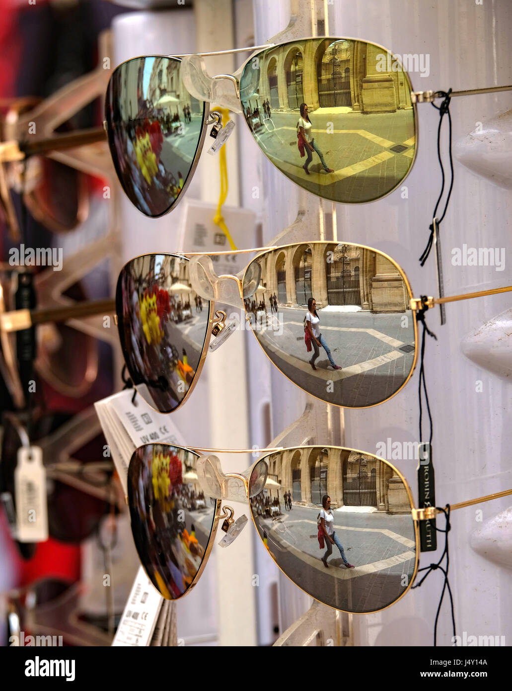 Sun Glasses on a display stand Stock Photo - Alamy