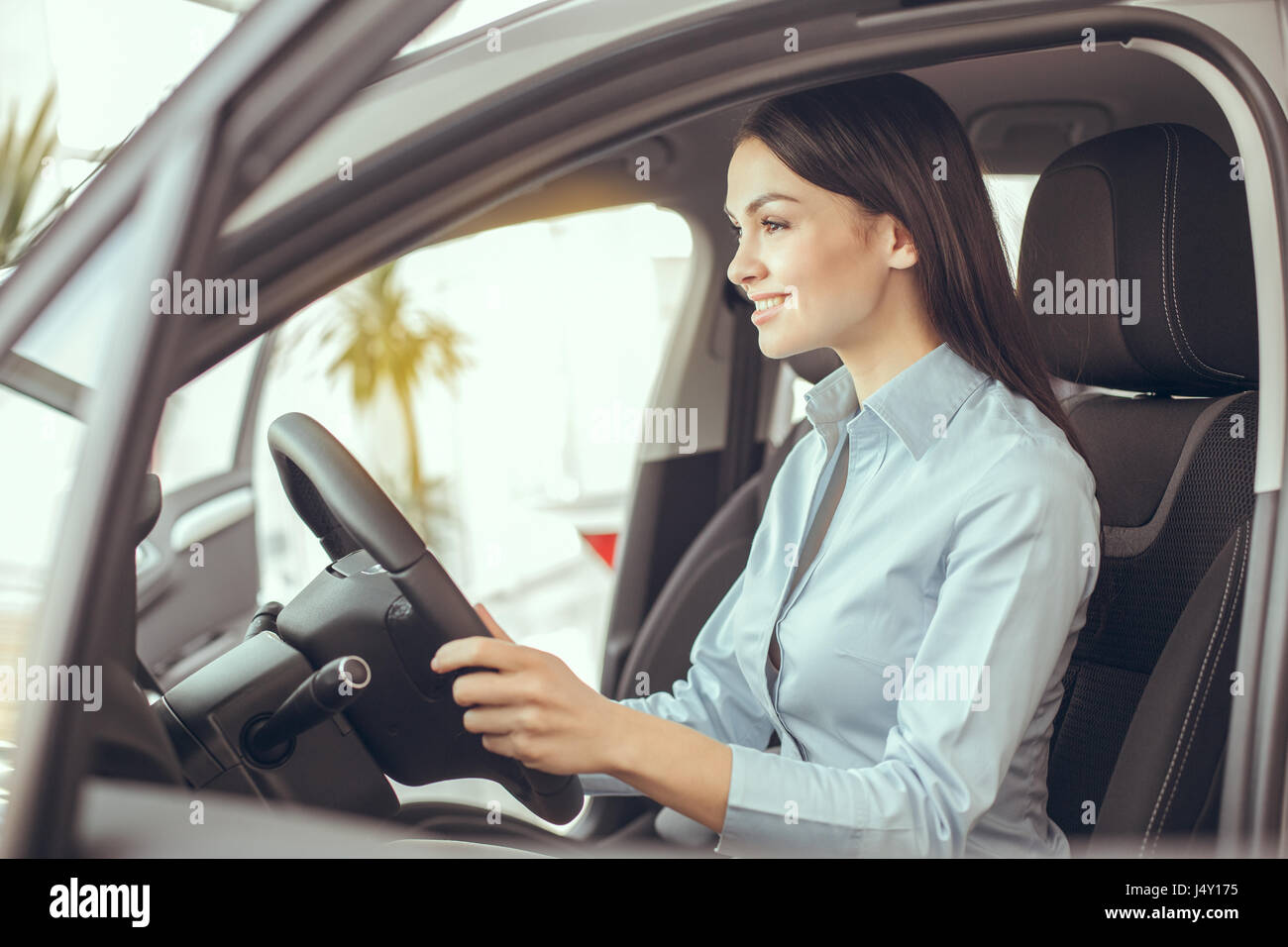 Young Woman in a Car Rental Service Test Drive Concept Stock Photo - Alamy