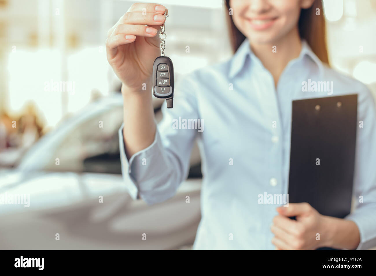 Young Woman in a Car Rental Service Assistant Concept Stock Photo - Alamy