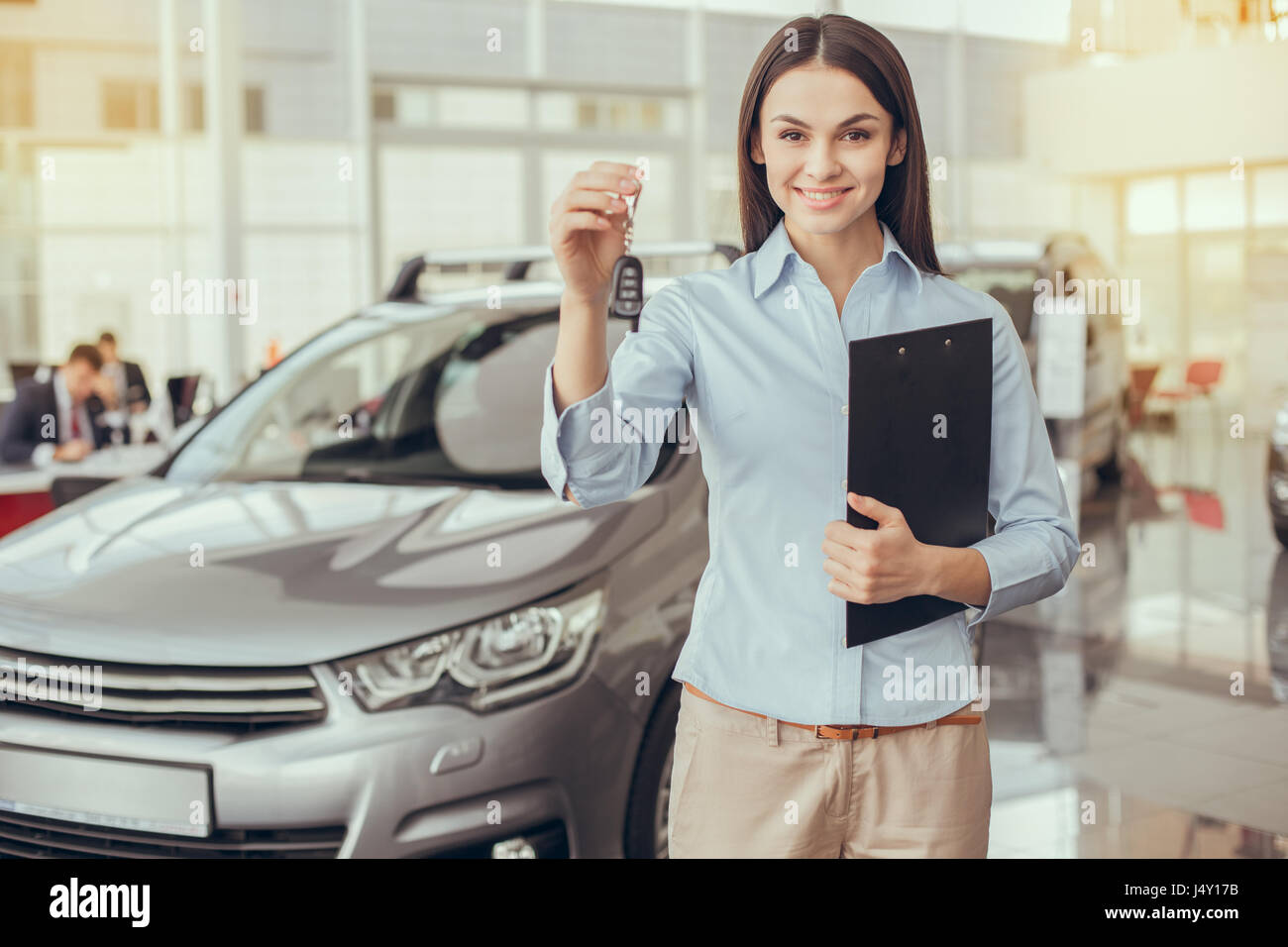 Young Woman in a Car Rental Service Assistant Concept Stock Photo - Alamy