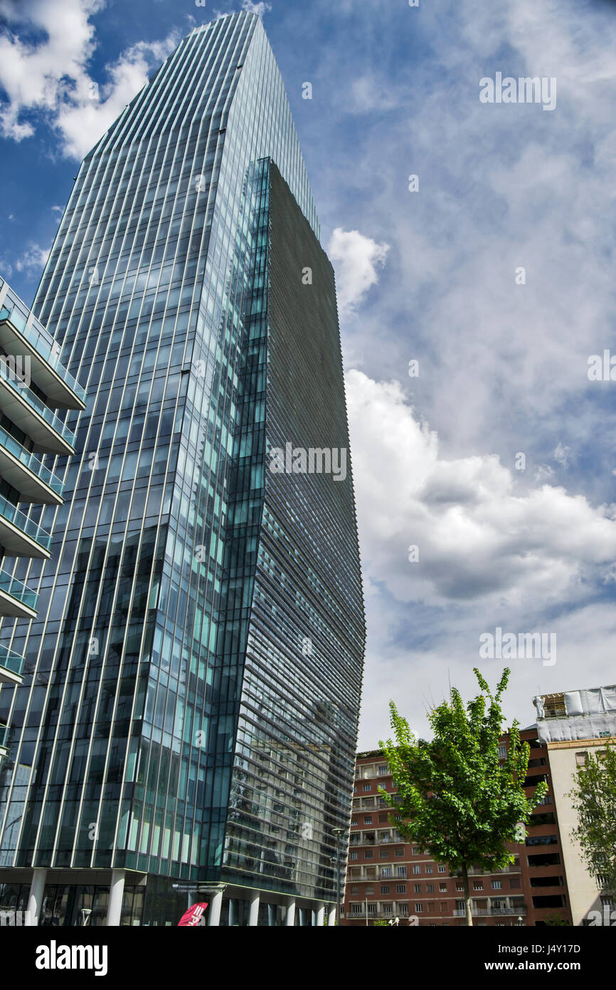 a view from below of diamond tower in milan dowtonw, a tall glass ...