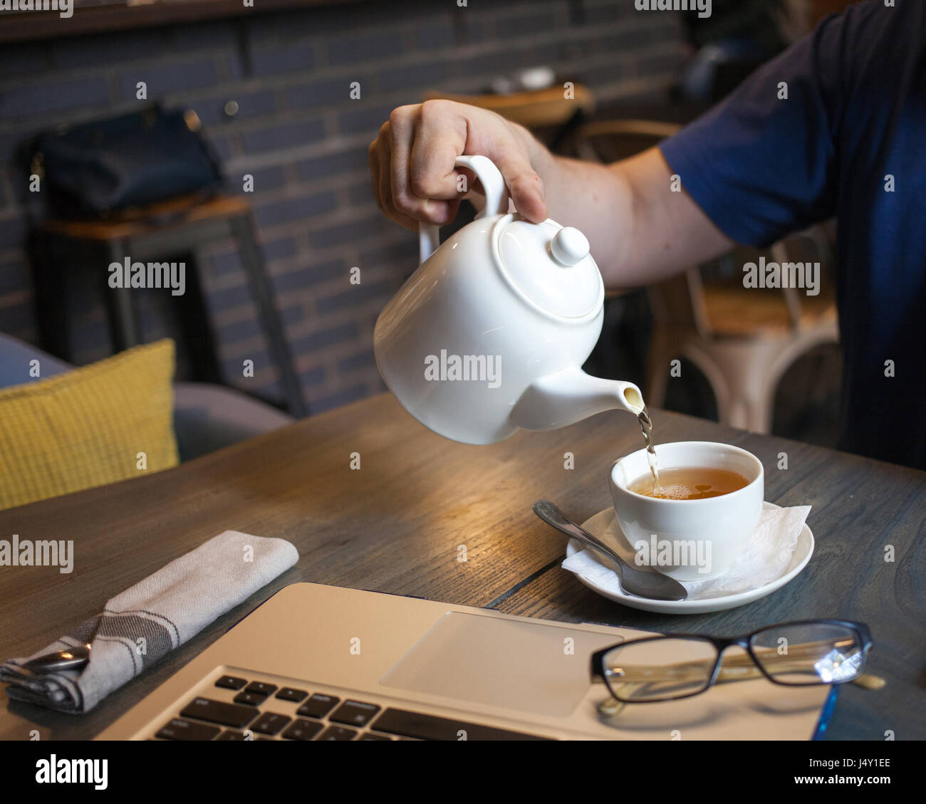 Guy drinking tea in cafe hi-res stock photography and images - Alamy