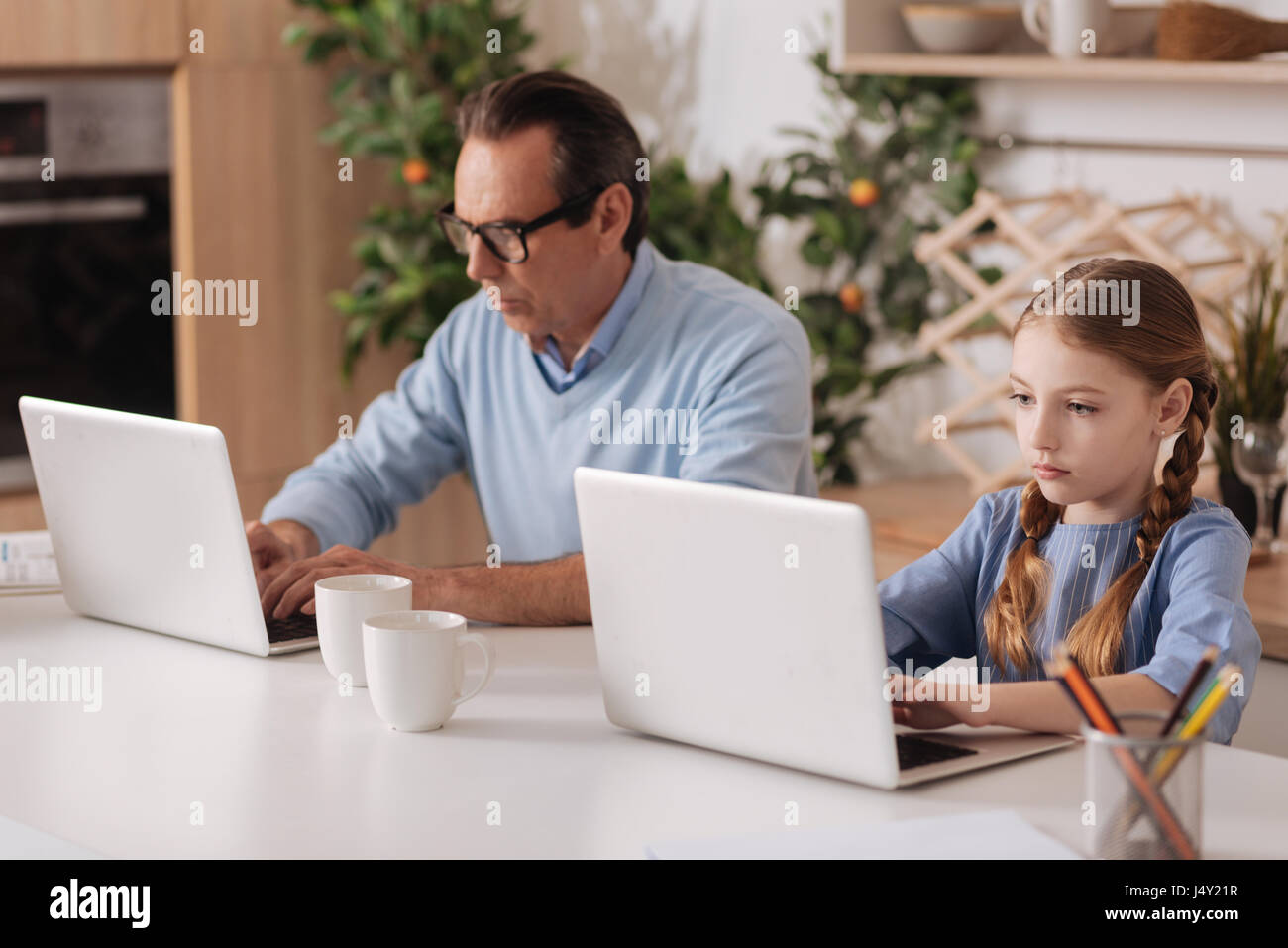 Grandfather child using laptop hi-res stock photography and images - Alamy