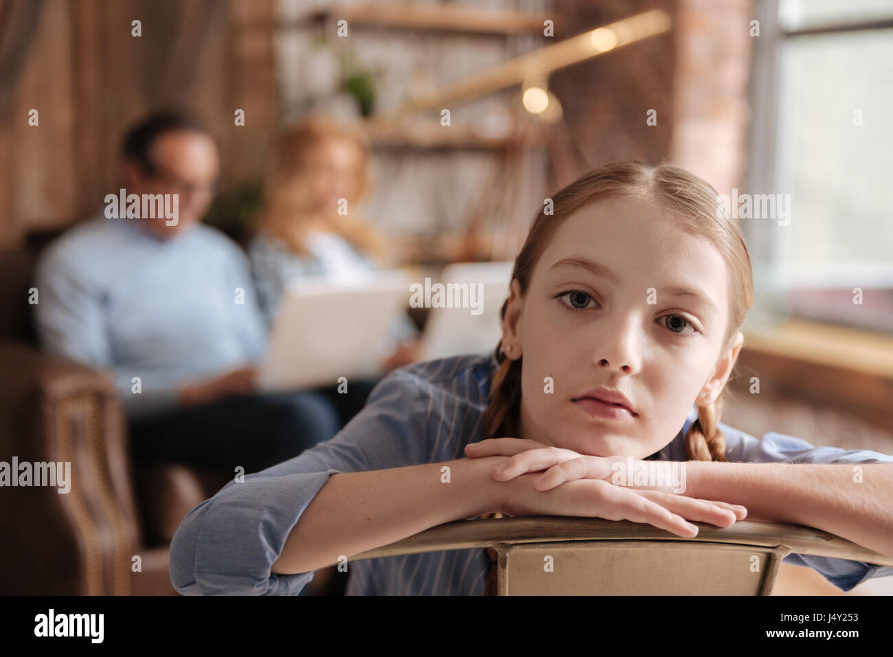Upset kid waiting for busy parents attention at home Stock Photo - Alamy