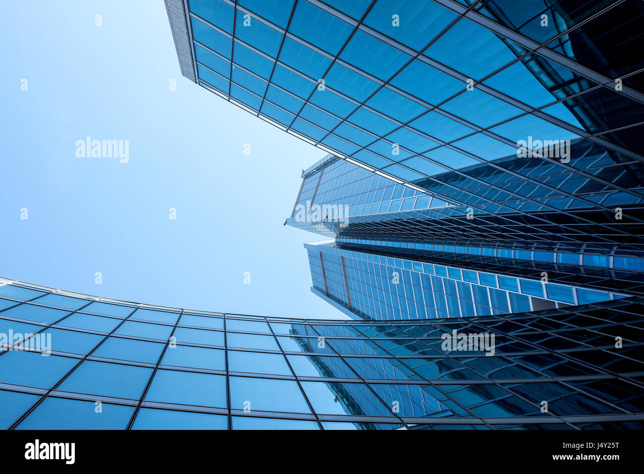 Modern and visionary skyscraper with many windows and reflections and ...