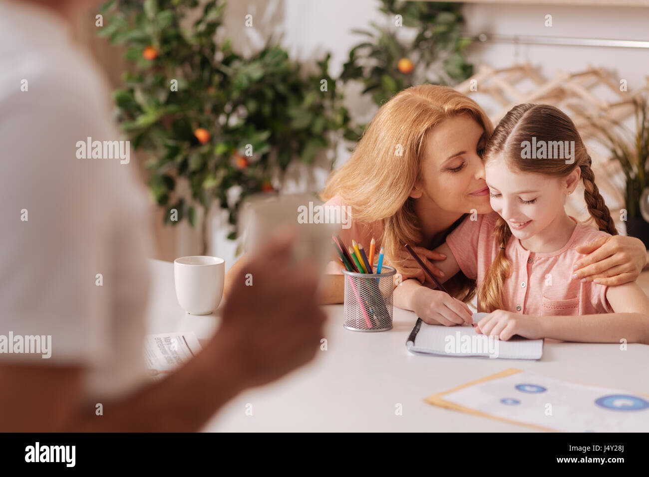 Loving family enjoying weekend at home Stock Photo - Alamy