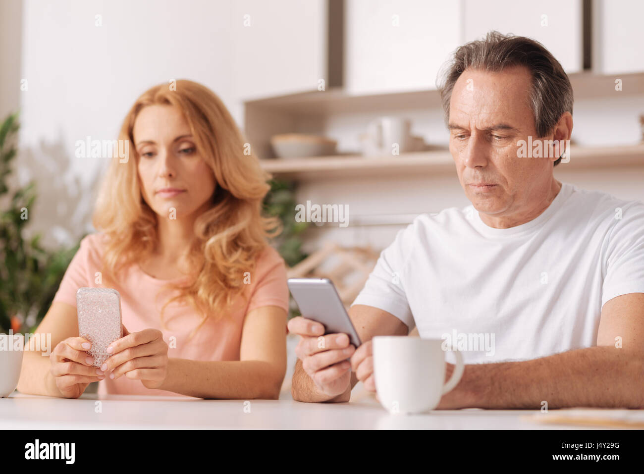 Involved family demonstrating Internet addiction indoors Stock Photo ...