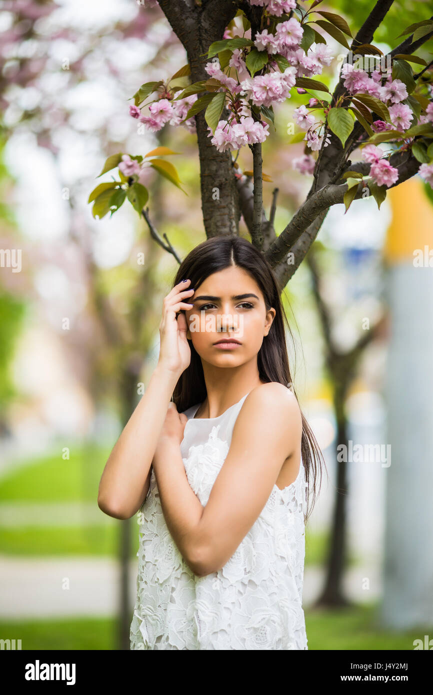 Girl with sakura tree flowers Spring concept Stock Photo - Alamy