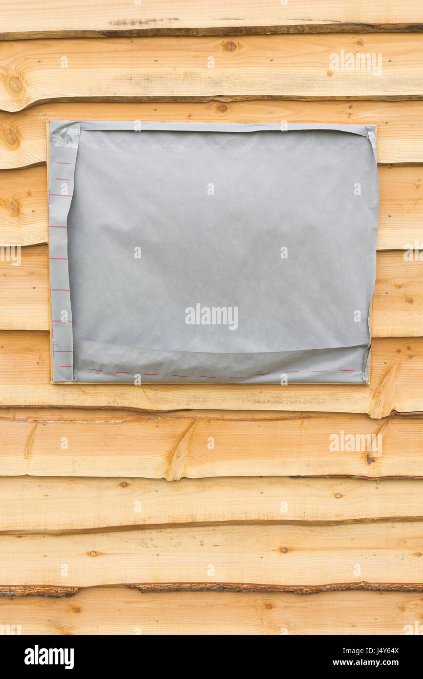 Wooden shingle wall (actually an outside office) with blanked out space ...