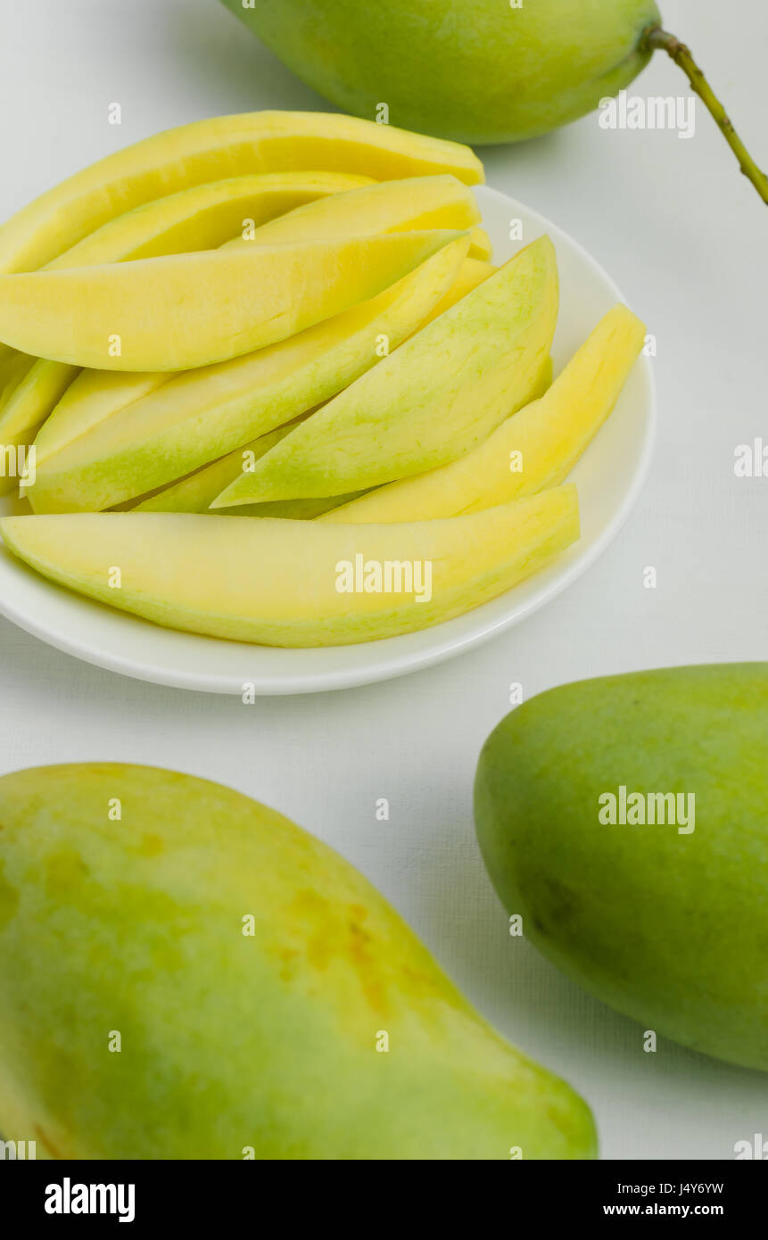 Sliced Mango In White Plate Stock Photo - Alamy