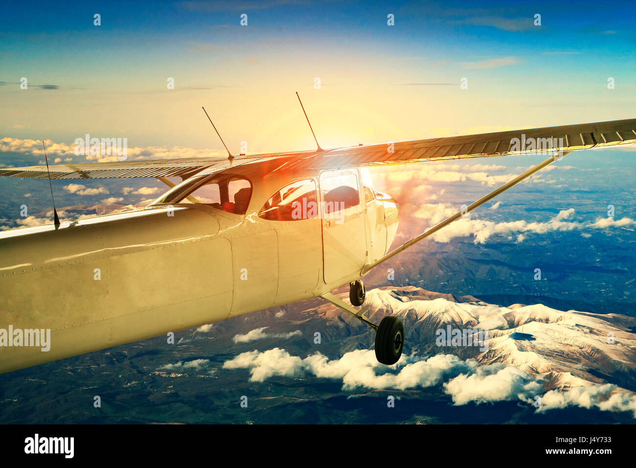 propeller plane flying over high mountain for traveling theme Stock ...