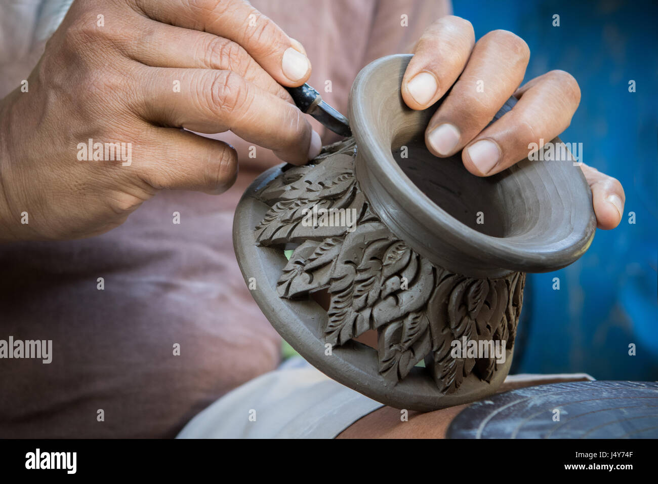close up potter artist working on clay pottery sculpture fine art in ...