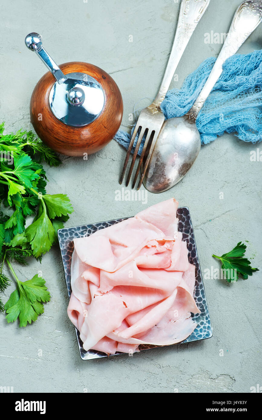 chicken ham on plate and on a table Stock Photo - Alamy