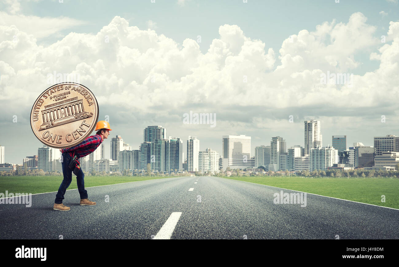 Builder man carry coin Stock Photo - Alamy