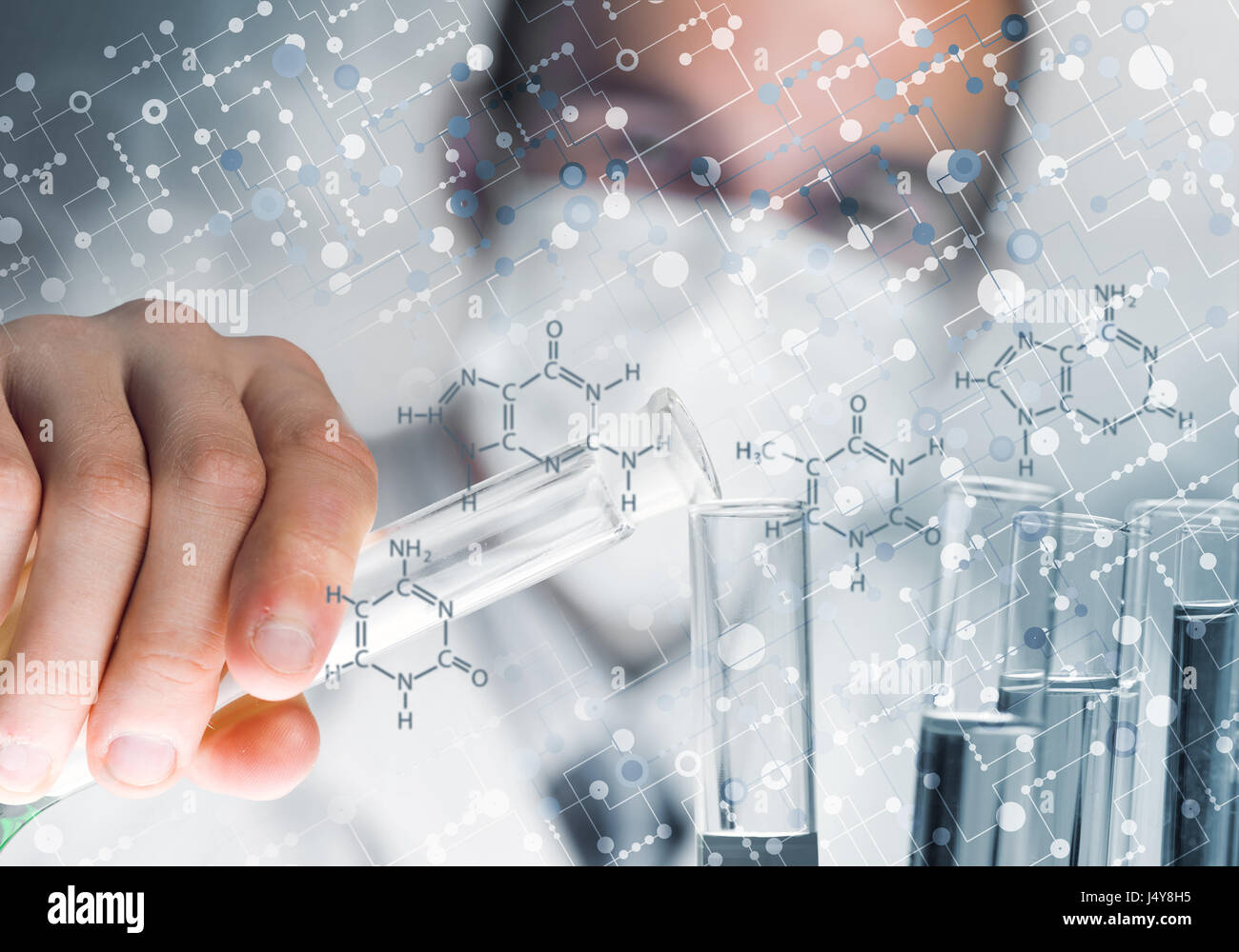 Portrait of concentrated male scientist working with reagents in laboratory Stock Photo - Alamy