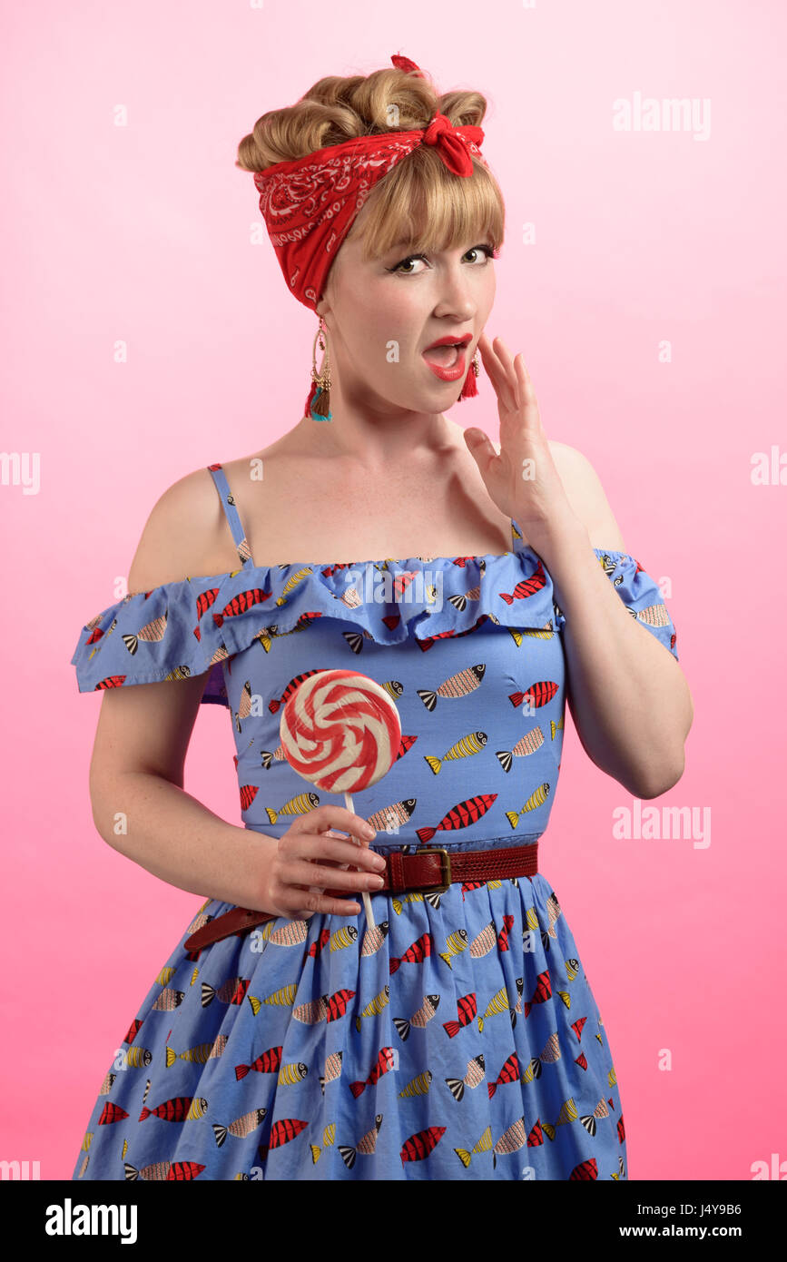 Cheeky pin up style image of woman with lollipop Stock Photo - Alamy
