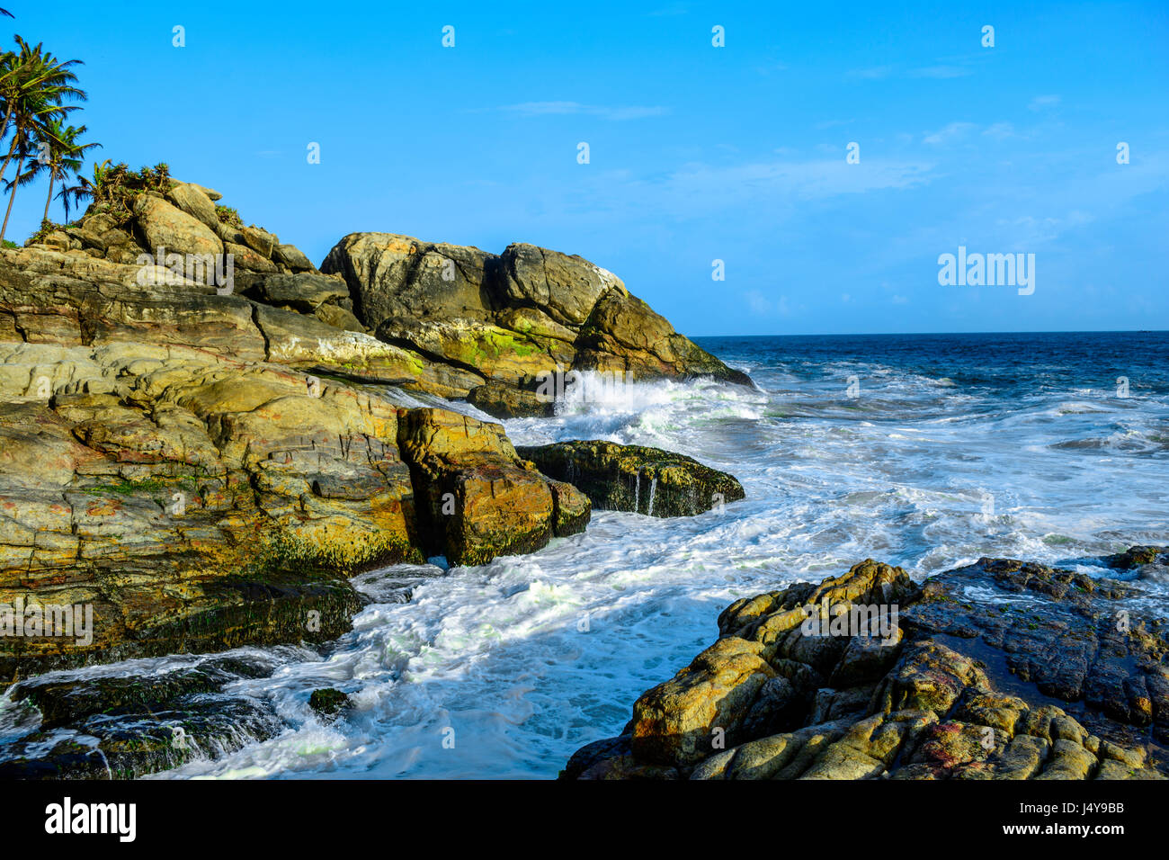 waves washing over Rocks Kerala Indian ocean Stock Photo - Alamy